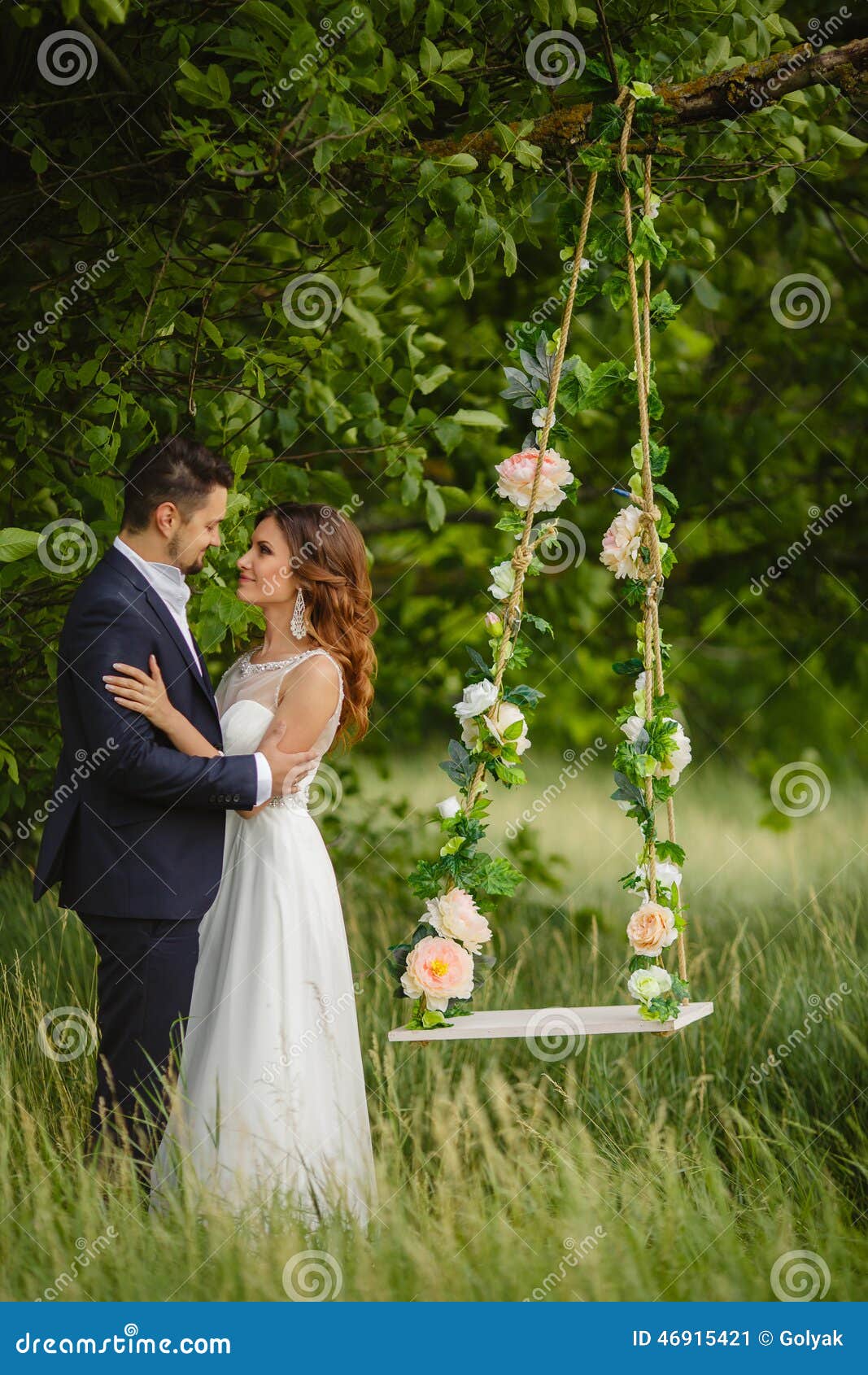 Beautiful Bride With Fiance Is Swinging On A Swing Stock Image Image