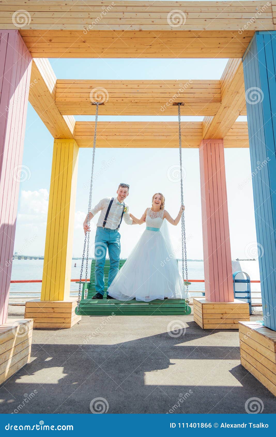 The Bride and Groom Ride on a Swing Stock Photo - Image of love ...