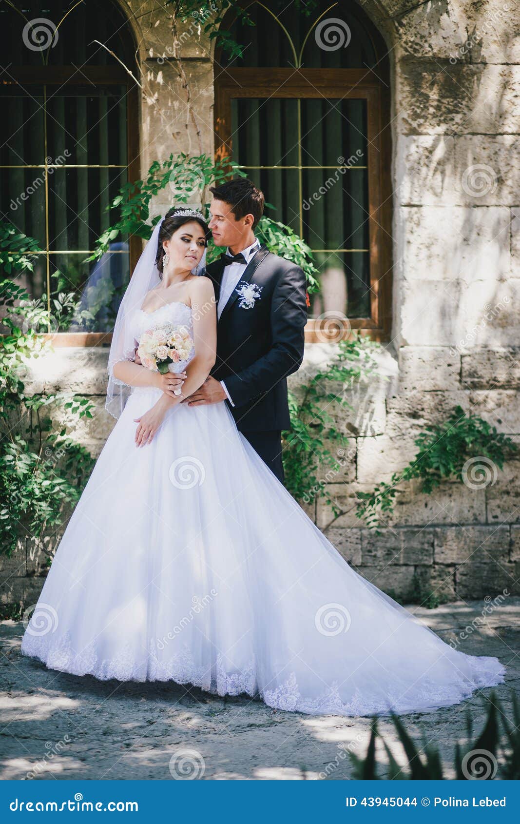 Beautiful Bride and Groom Posing in a Yard of a Castle Stock Photo ...