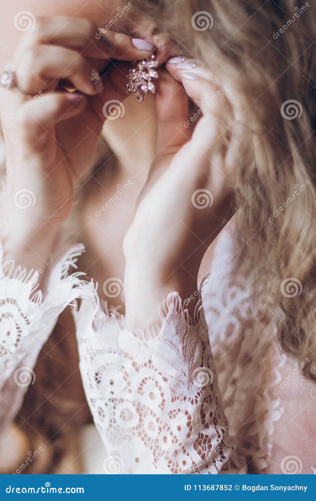 Beautiful Bride In Lace Robe Putting On Luxury Earrings Bridal Stock