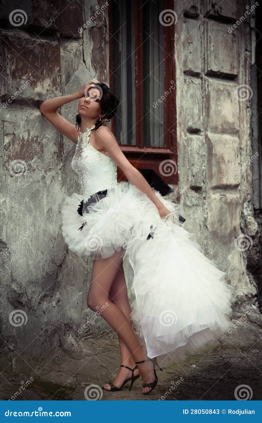 Beautiful Bride Leaning Against the Wall of an Old Building Stock Image ...