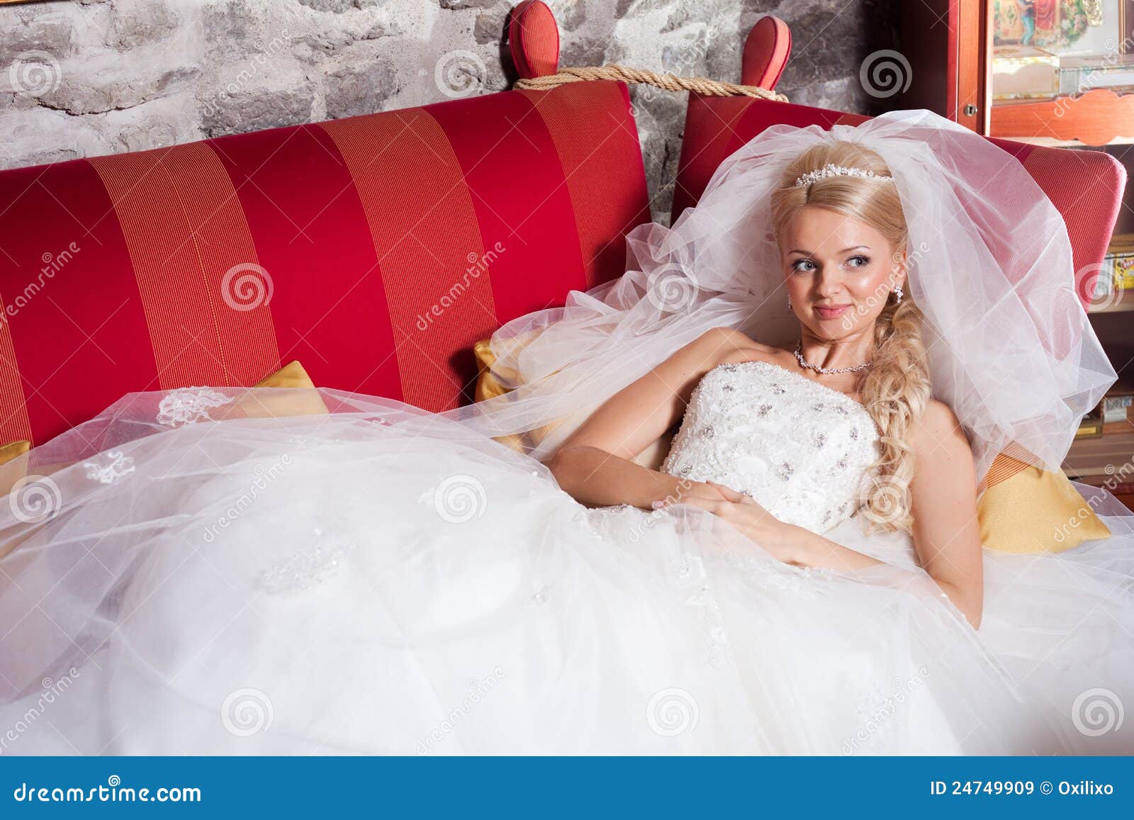 Beautiful Bride Lying on Red Sofa Stock Image - Image of gentle, dress ...