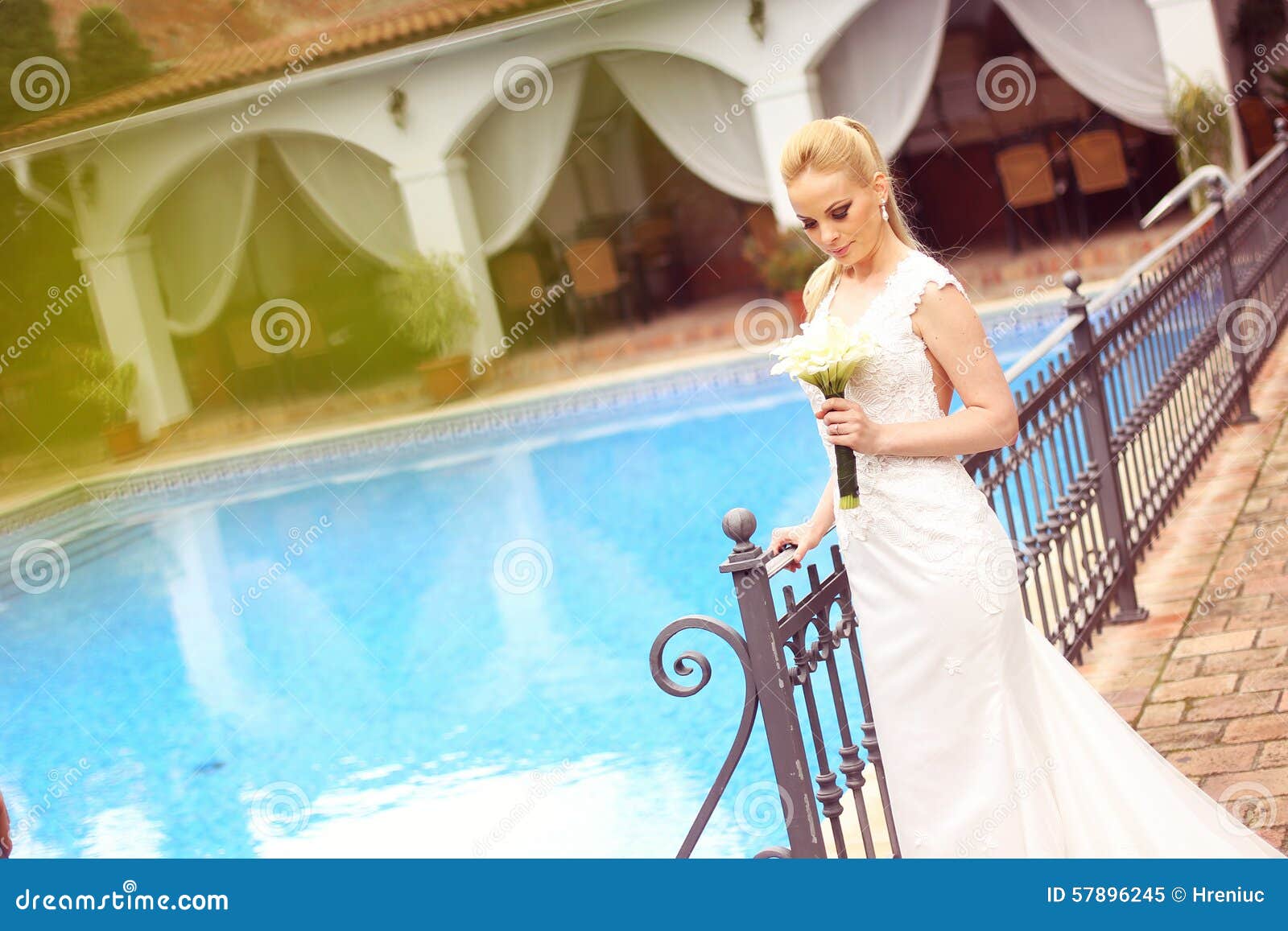 Beautiful bride near pool stock image. Image of pool - 57896245