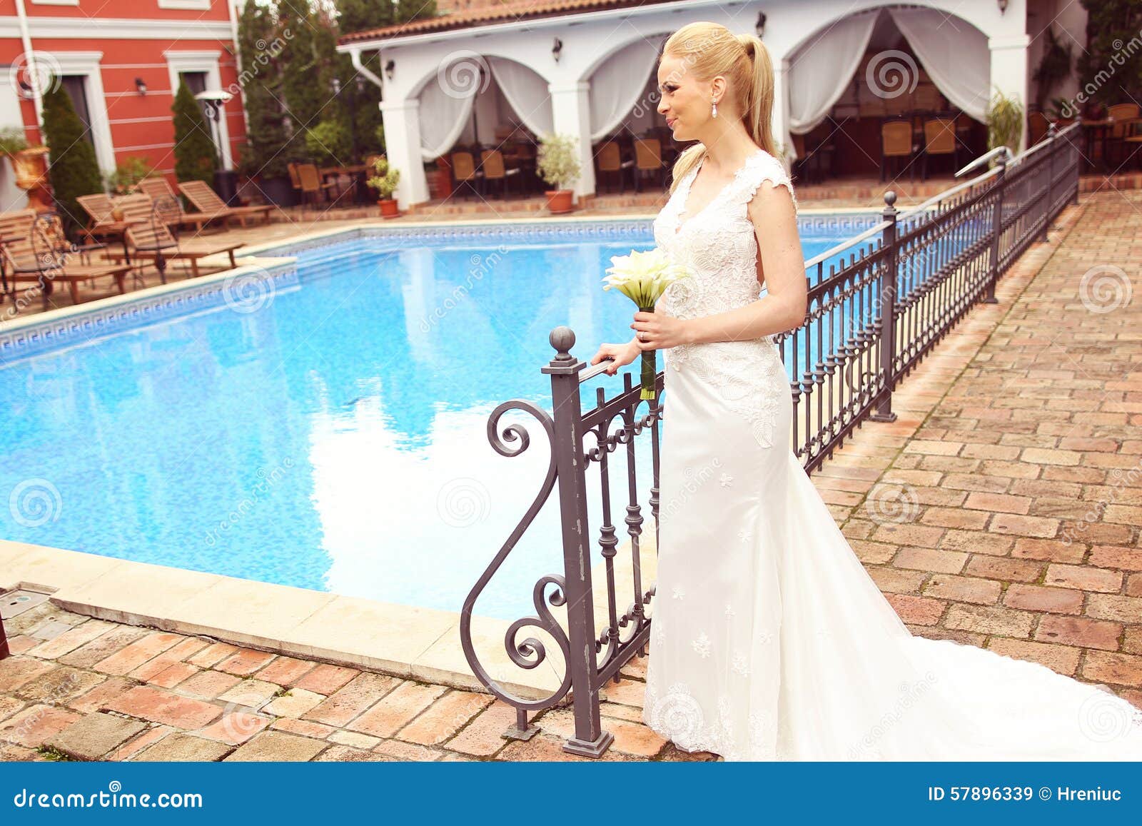 Beautiful bride near pool stock image. Image of lady - 57896339
