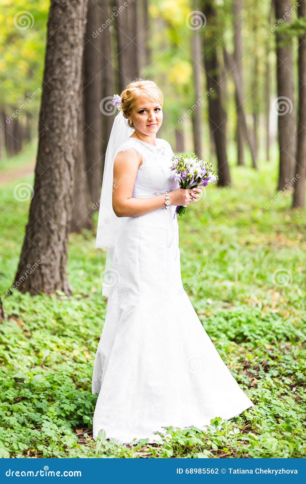 Beautiful bride outdoors stock photo. Image of flowers - 68985562