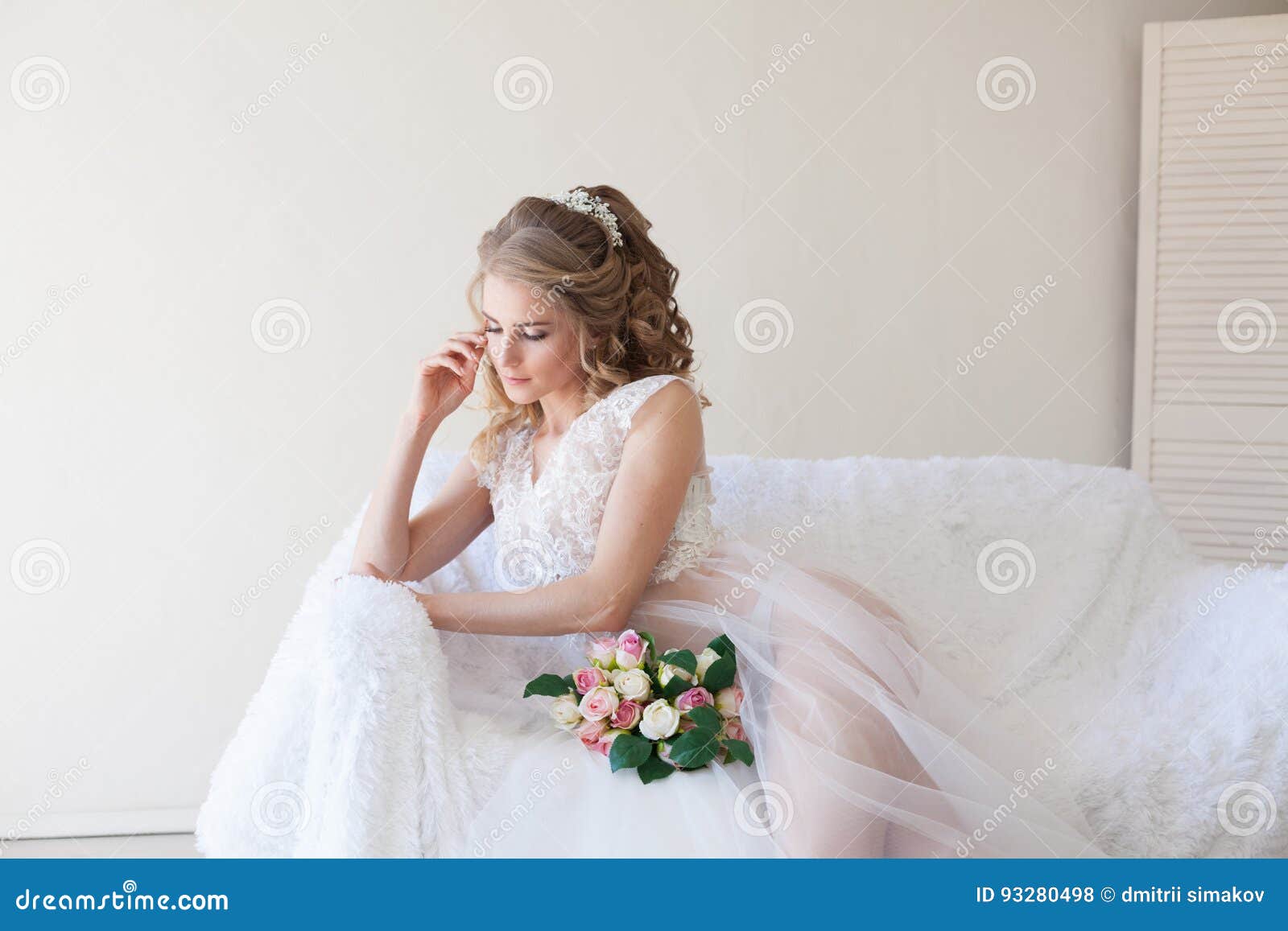 Beautiful Bride Sitting on a White Couch in Lingerie Stock Photo ...