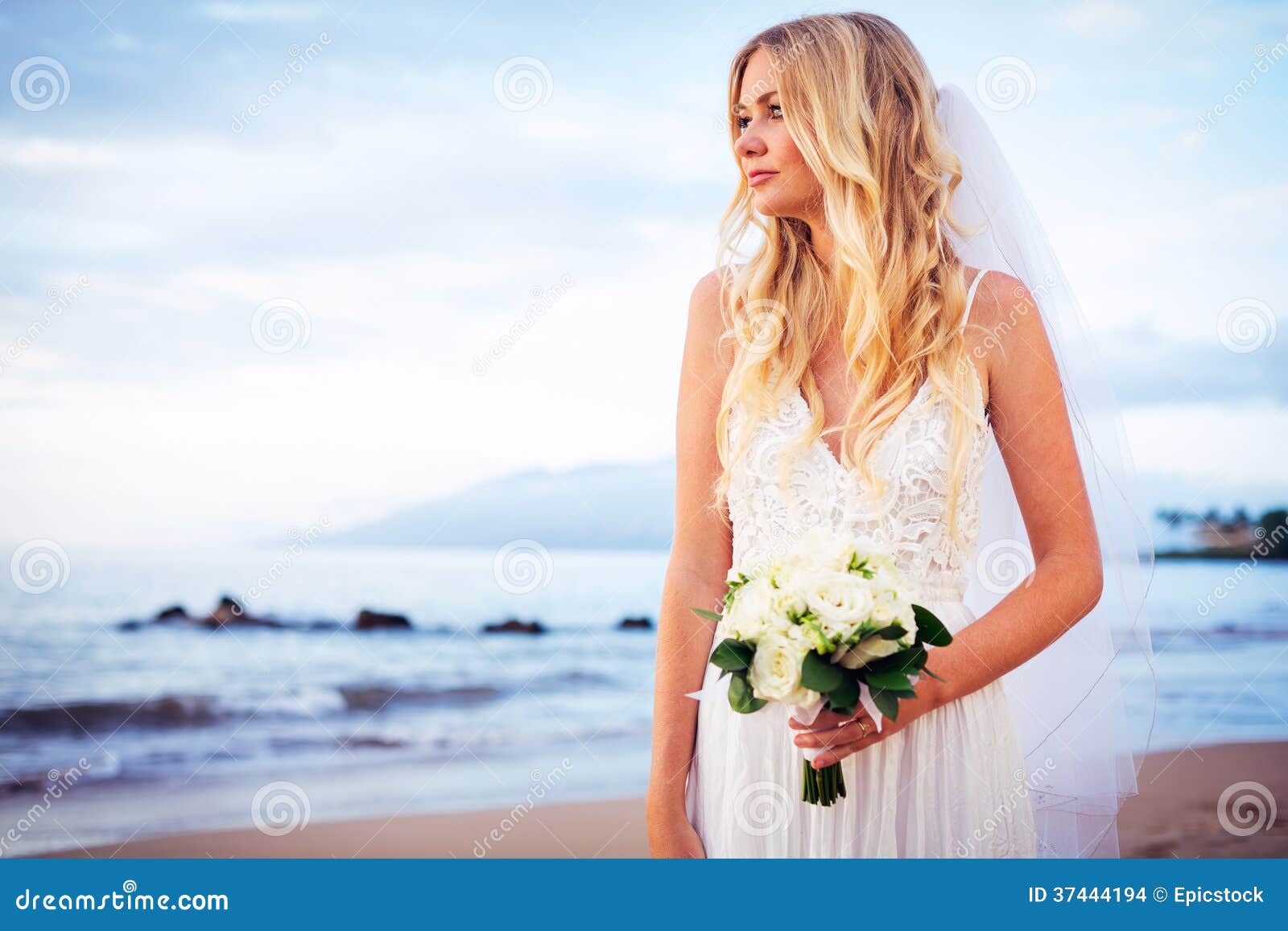Beautiful Bride Standing by the Beach at Sunset Stock Photo - Image of ...
