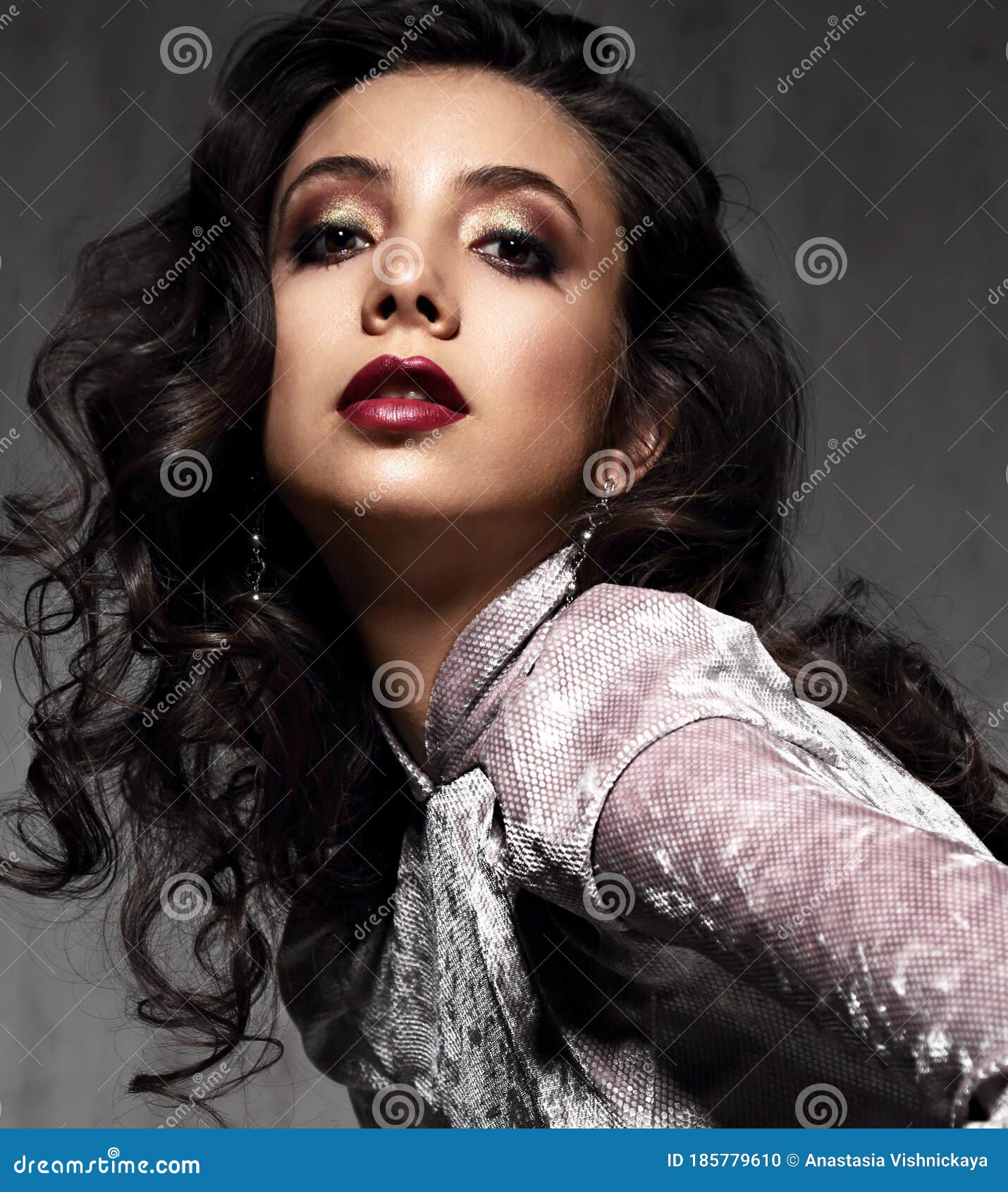 Beautiful Bright Makeup Woman With Long Black Curly Hair Style Posing