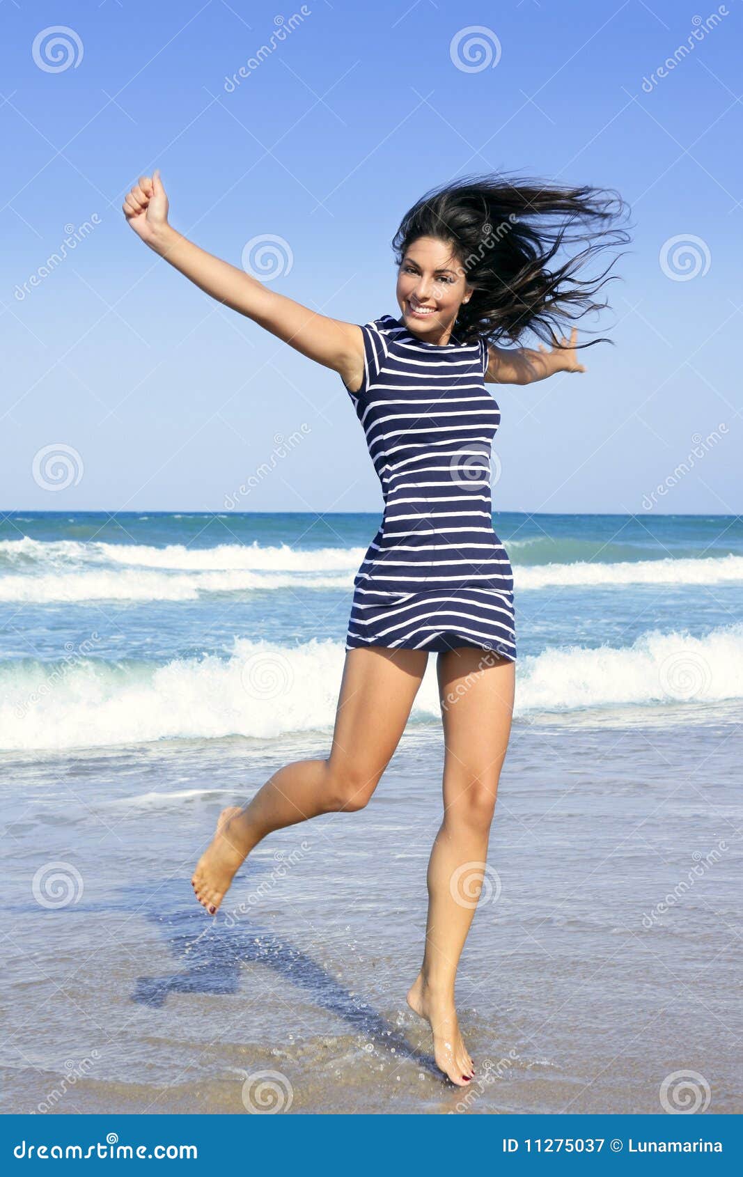 Beautiful Brunette Girl Jumping On The Beach Stock Image Image Of