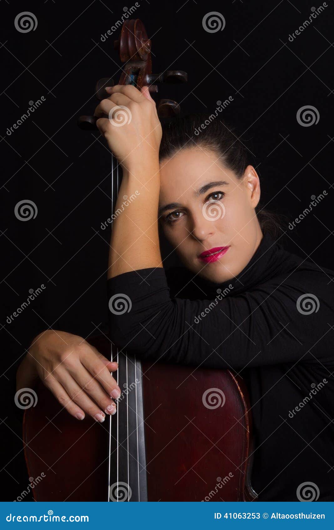 Beautiful Brunette Holding Cello with Selective Light in Black D Stock ...