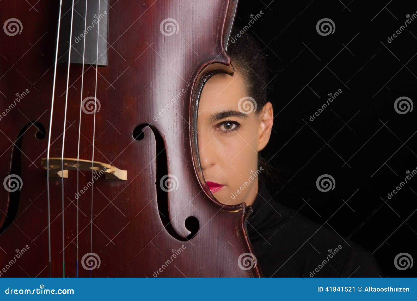 Beautiful Brunette Holding Cello with Selective Light in Black D Stock ...