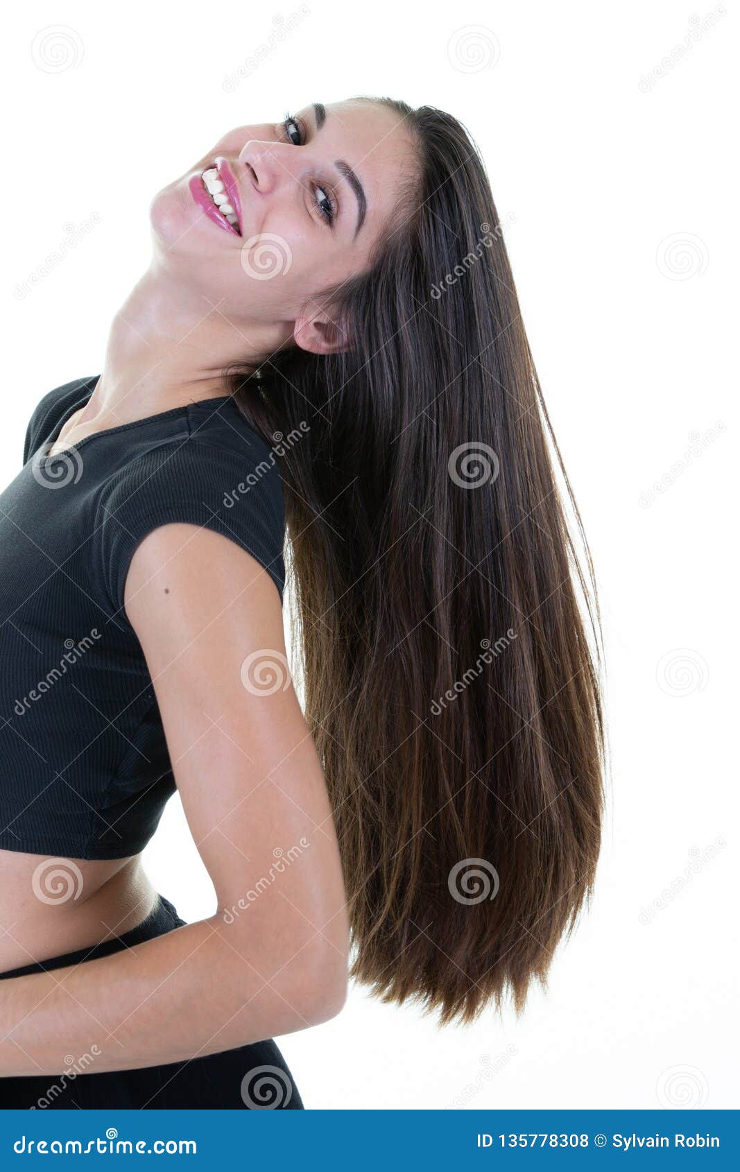 A Beautiful Brunette With Long Hair In Front Of White Background Stock