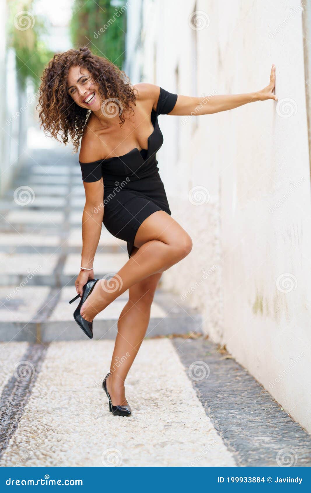 Beautiful Brunette Middle-aged Woman Wearing Dress and High Heels ... Beautiful Brunette Middle-aged Woman Wearing Dress and High Heels ...