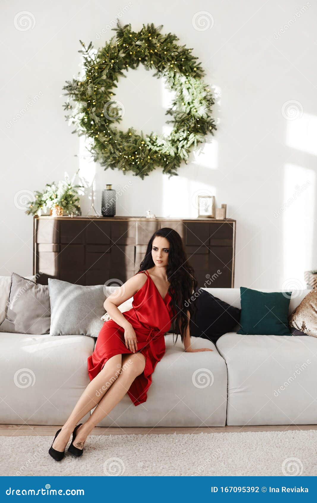 Beautiful Brunette Model Girl With Perfect Slim Body And Legs In The Modish Red Dress And Shoes