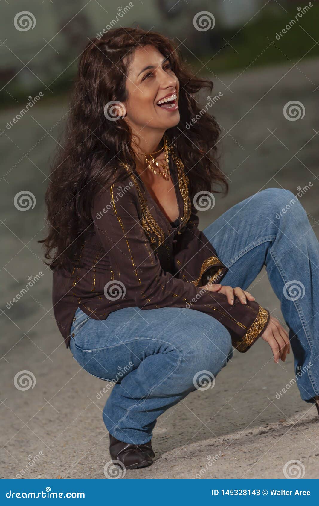 A Lovely Brunette Model Posing Outdoors With The Latest Fashions Stock