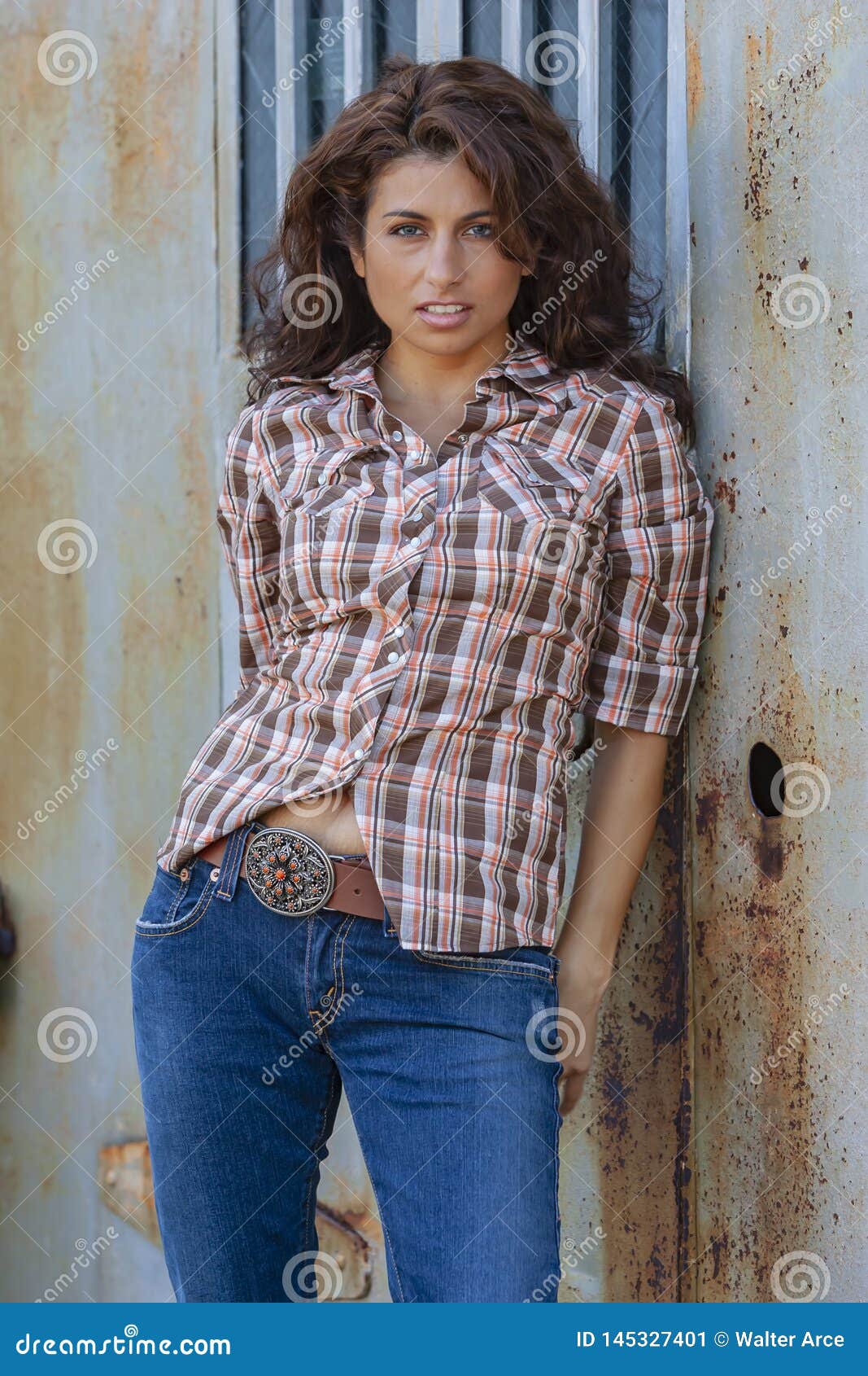 A Lovely Brunette Model Posing Outdoors With The Latest Fashions Stock