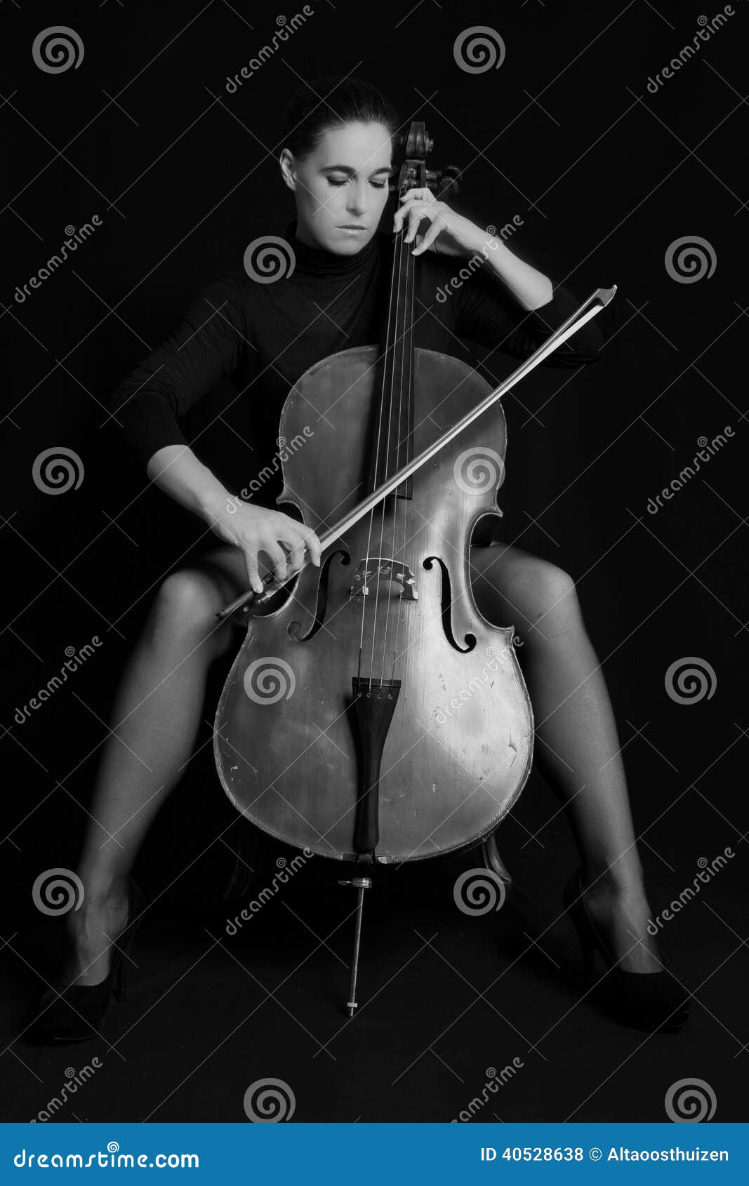 Beautiful Brunette Playing a Cello with Selective Light in Black Stock ...