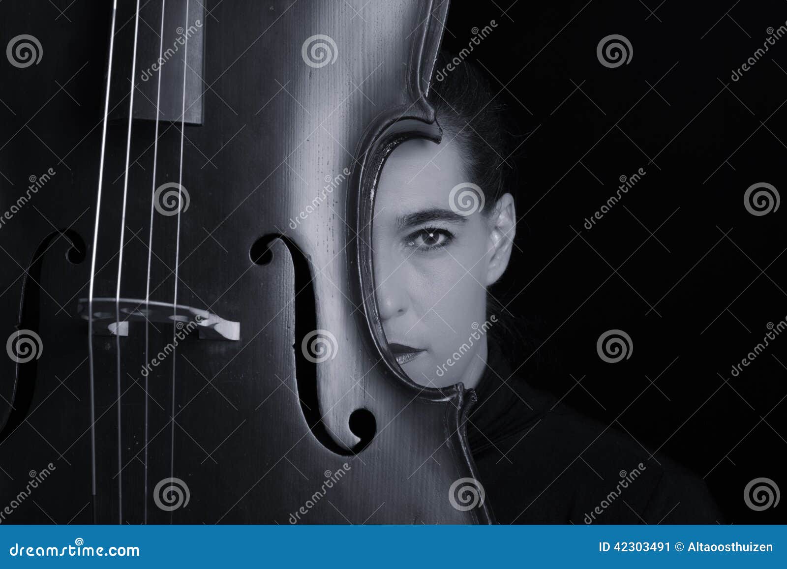 Beautiful Brunette Playing a Cello with Selective Light in Black Stock ...