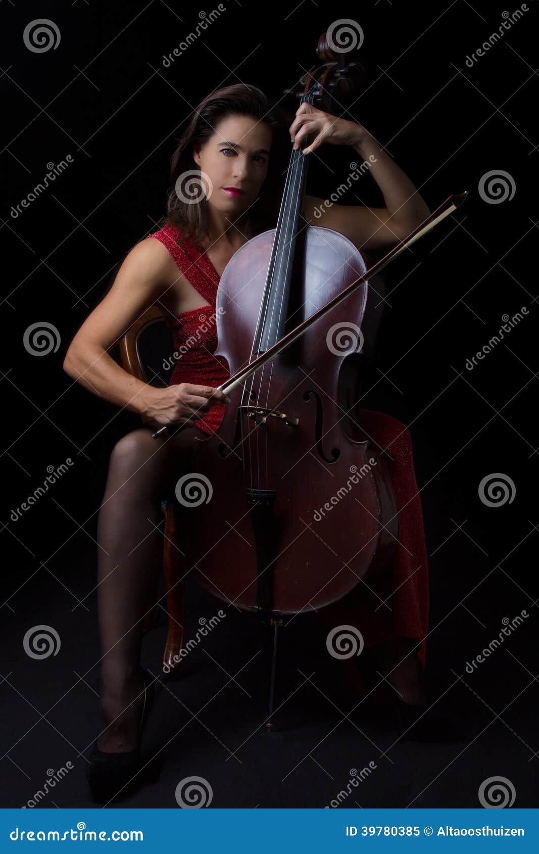Beautiful Brunette Playing Cello with Selective Light in Red Dress ...