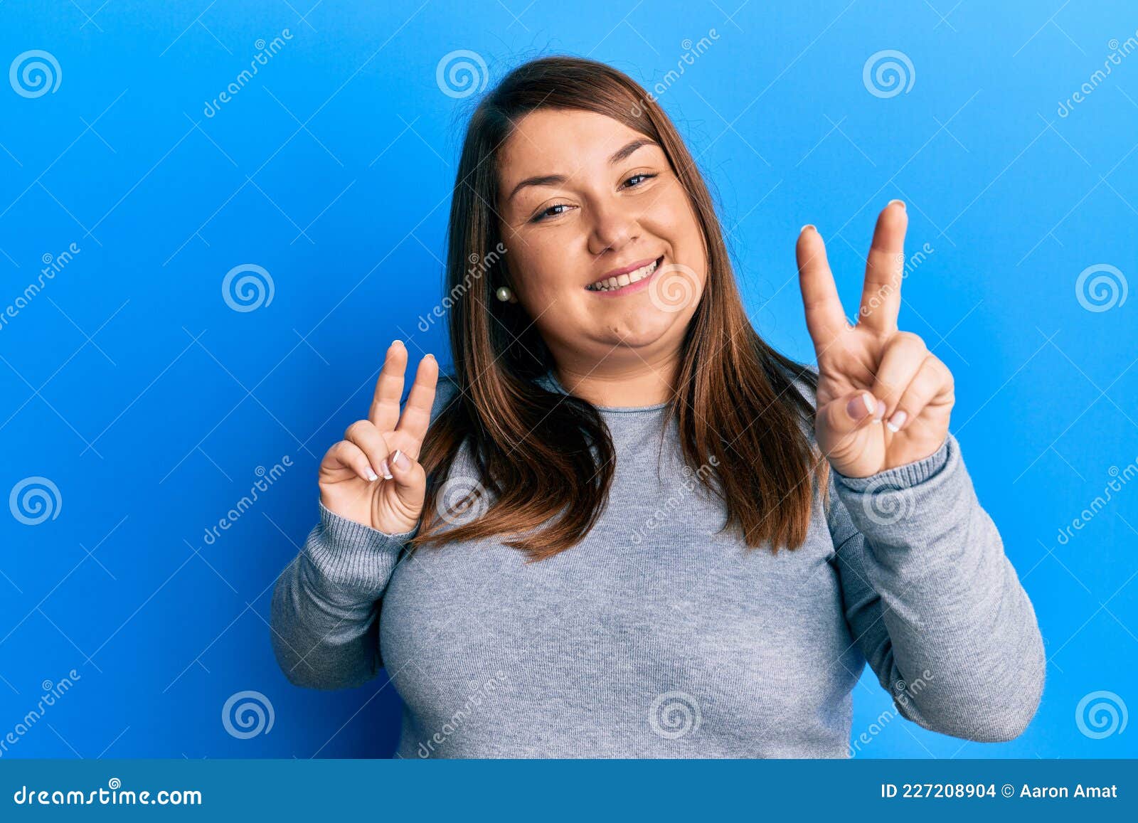 Beautiful Brunette Plus Size Woman Wearing Casual Clothes Smiling