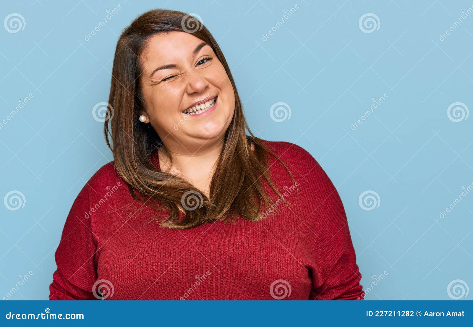 Beautiful Brunette Plus Size Woman Wearing Casual Clothes Winking
