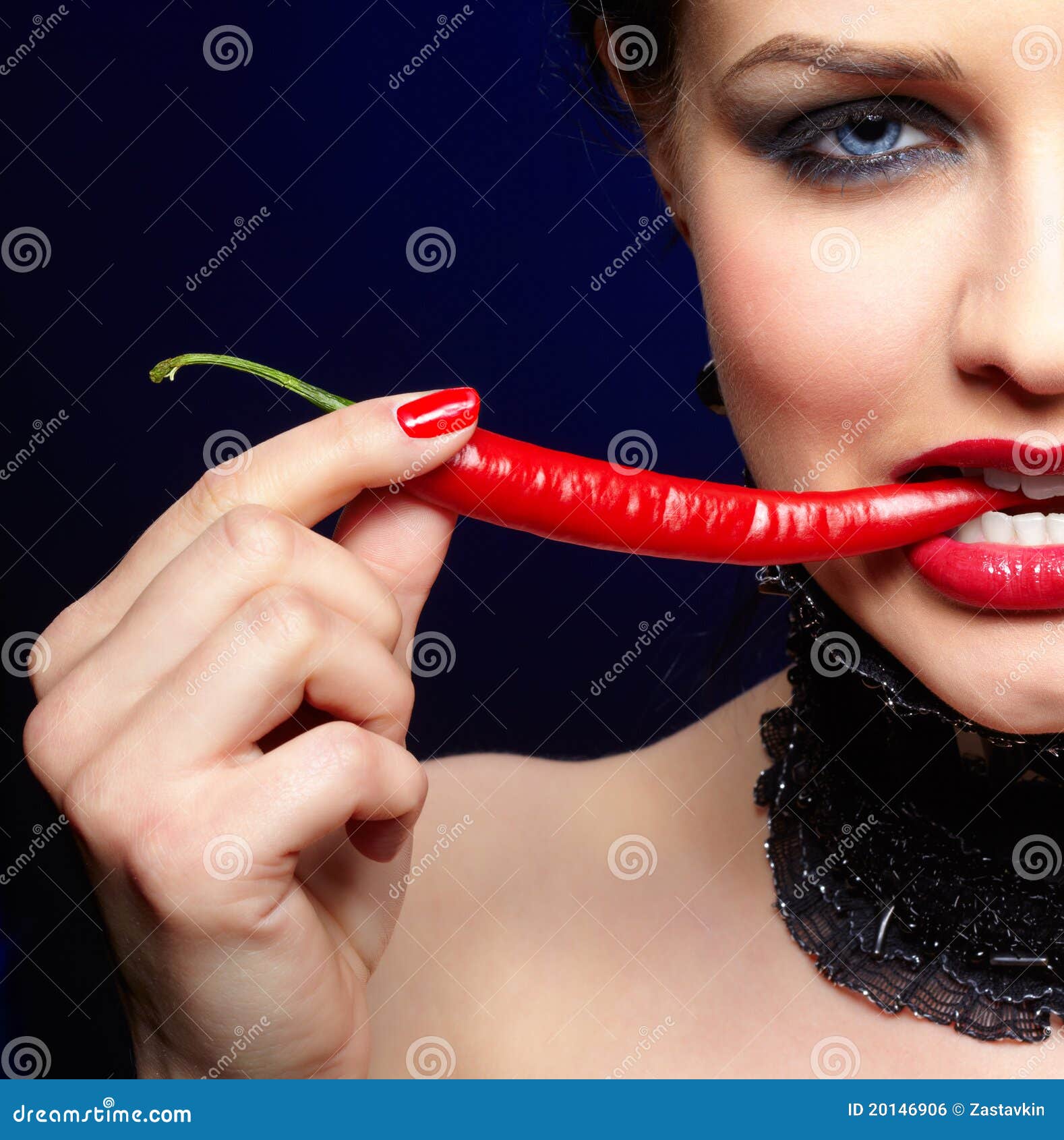 Beautiful Brunette Woman with Chili Pepper Stock Photo - Image of bite ...