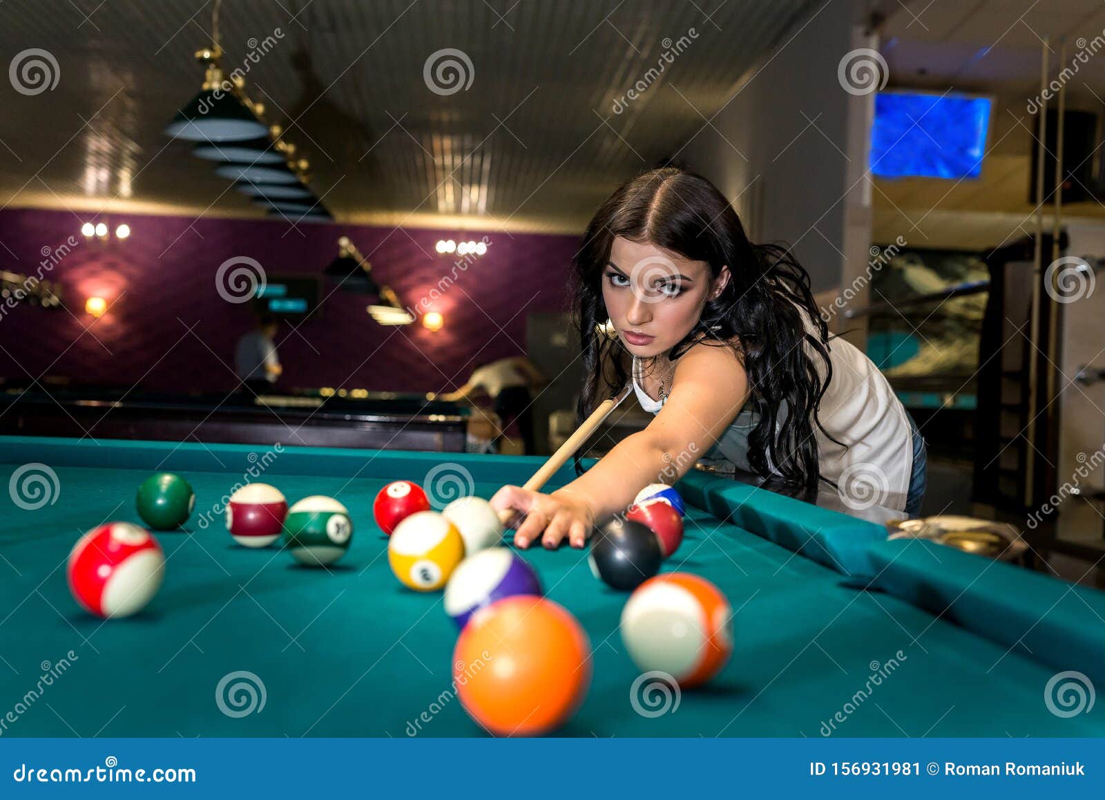 Beautiful Brunette Woman Concentrated On Billiard Game Stock Image