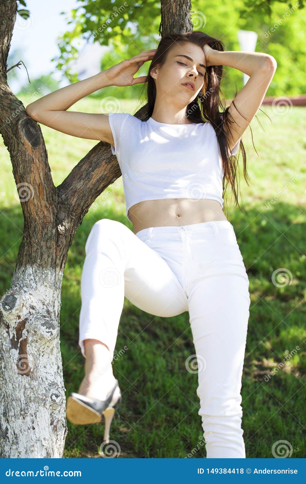 Beautiful Brunette Woman Posing Against Summer Park Bright Sunny