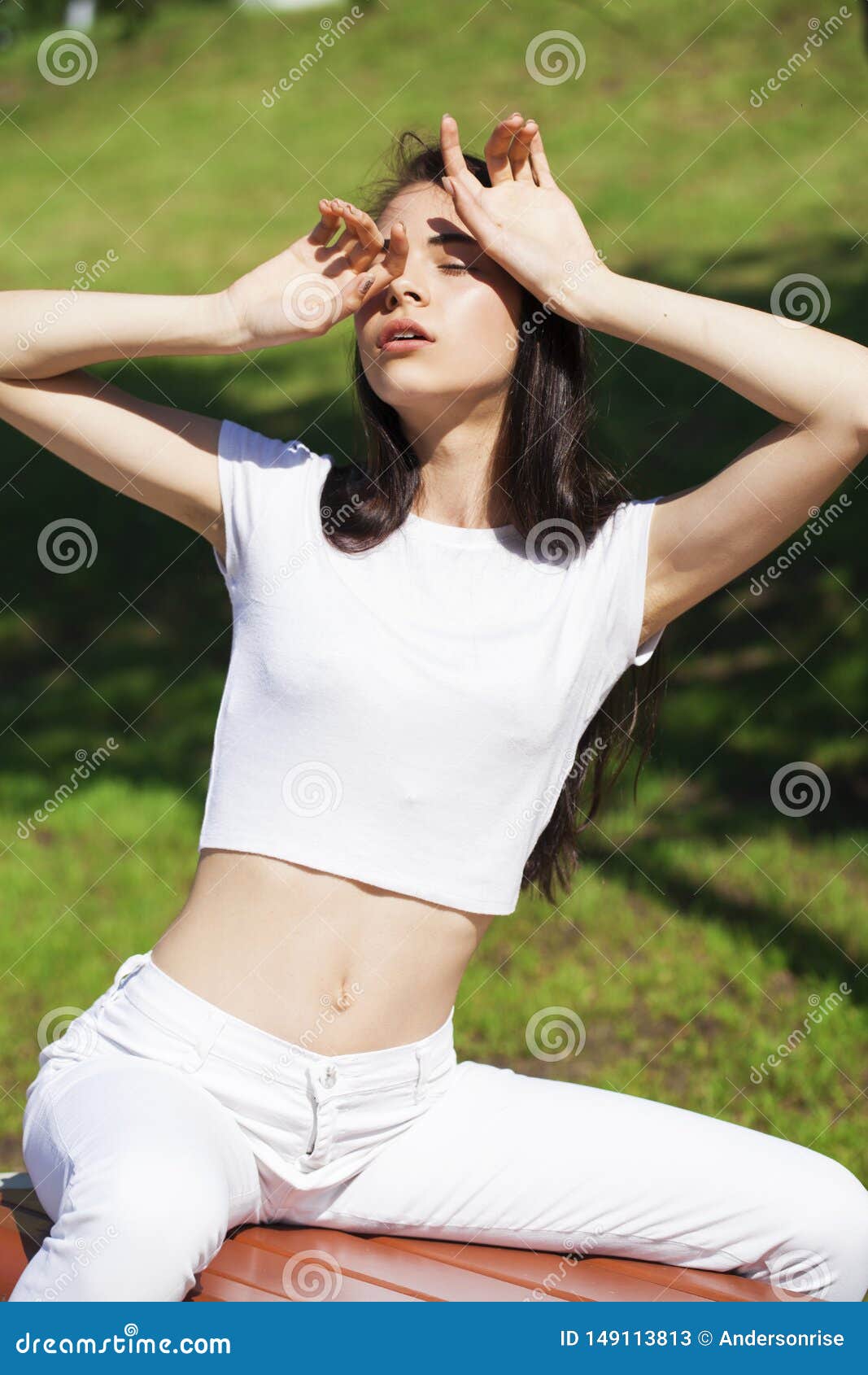 Beautiful Brunette Woman Posing Against Summer Park Bright Sunny