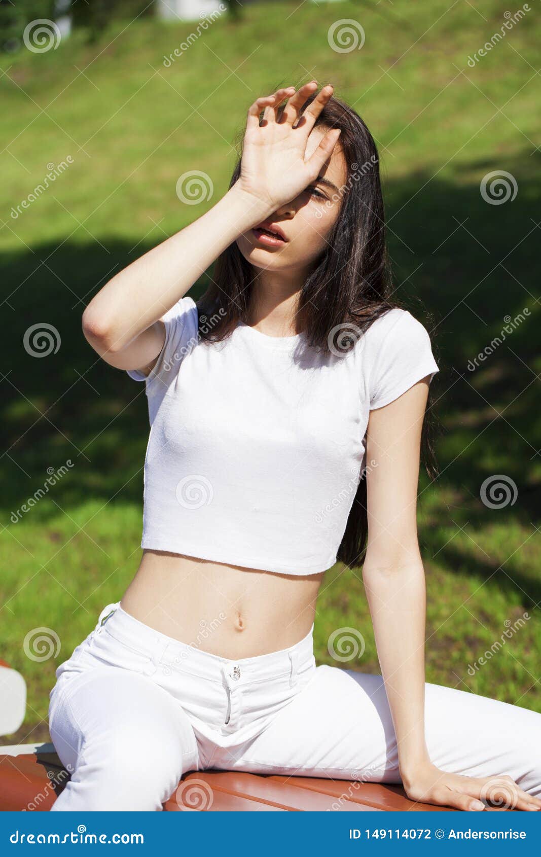 Beautiful Brunette Woman Posing Against Summer Park Bright Sunny