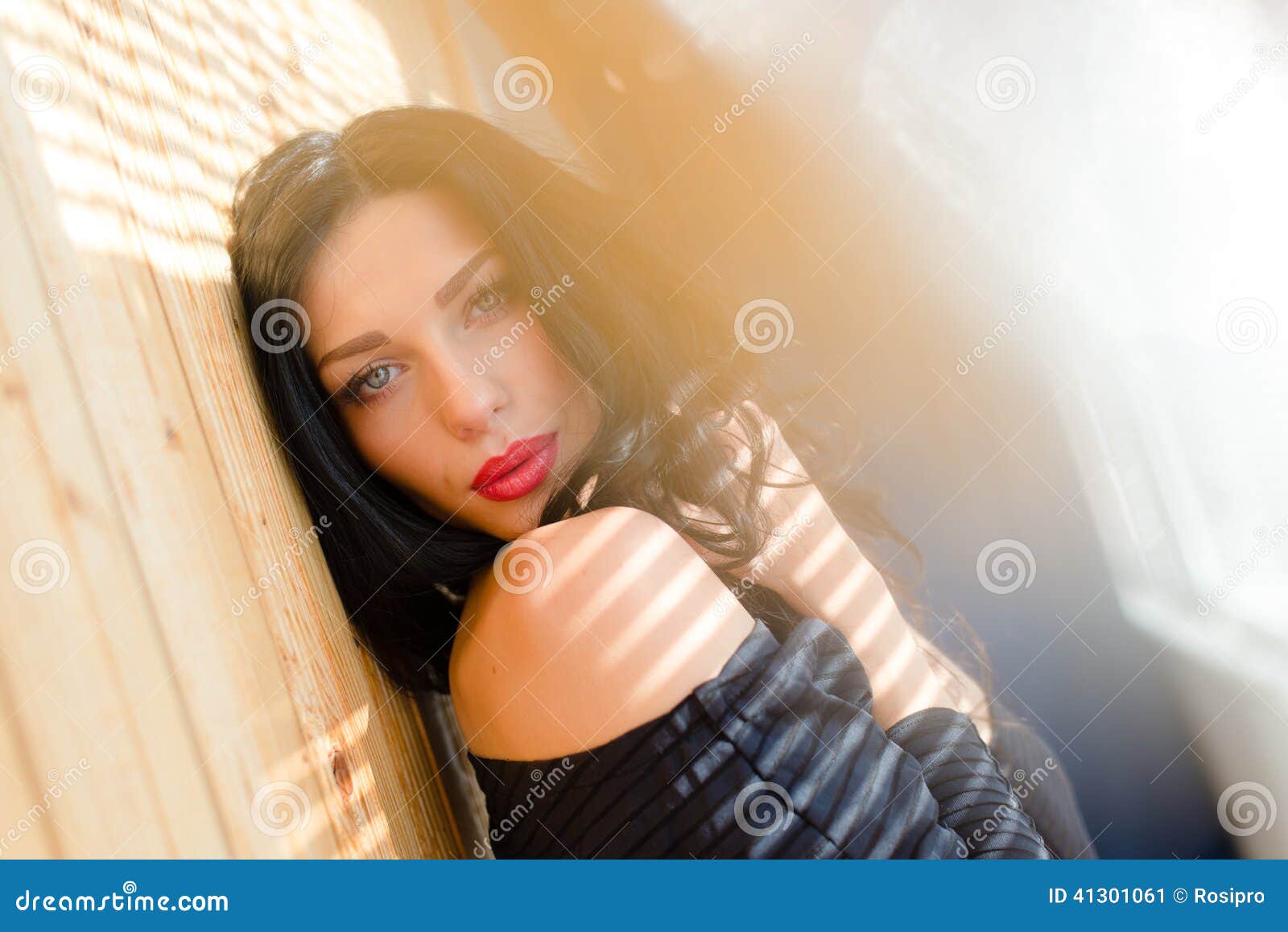 Beautiful Brunette Young Woman With Red Lips Looking At Camera