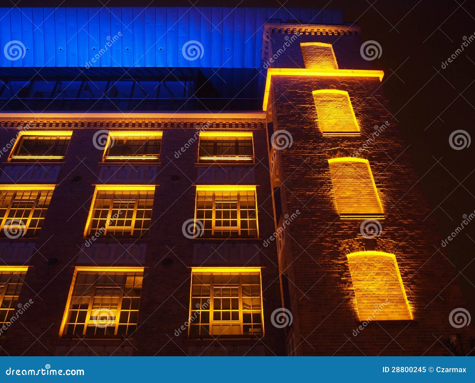 Beautiful Building Illuminated in Yellow, Red and Blue Stock Image ...