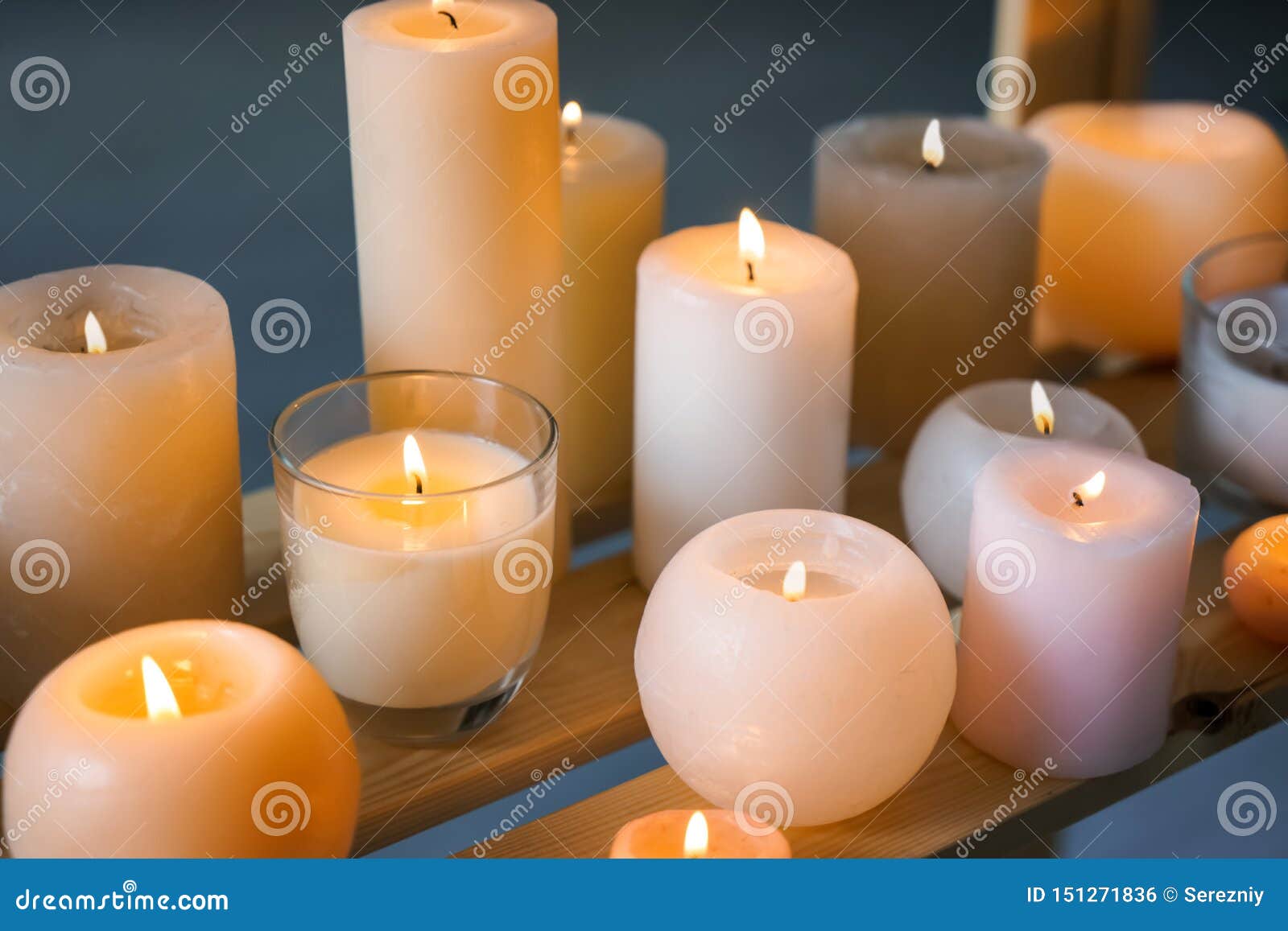 Beautiful Burning Candles on Shelf Stock Photo - Image of fire, candles ...