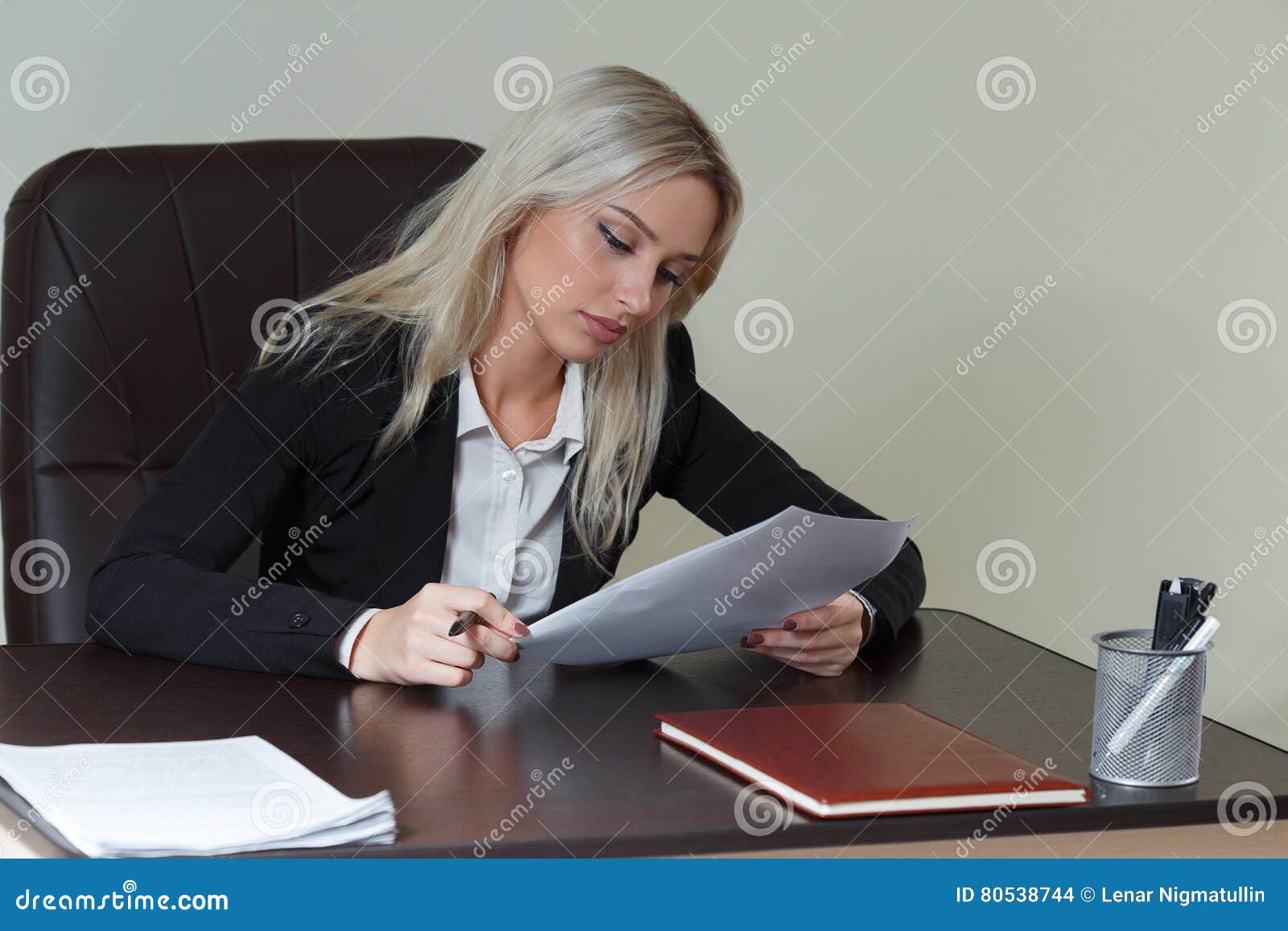 Beautiful Businesswoman Working at Her Office Desk with Documents ...