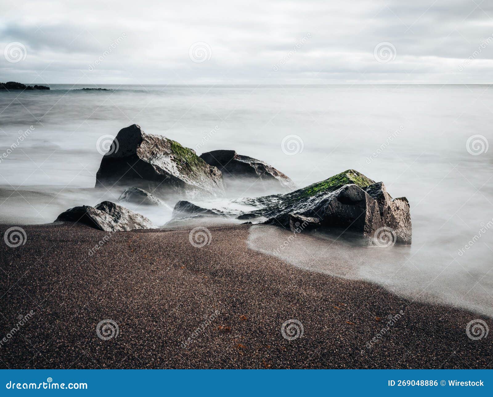 Beautiful Calm Sea with a Sandy Shore, Large Stones in it Stock Photo ...