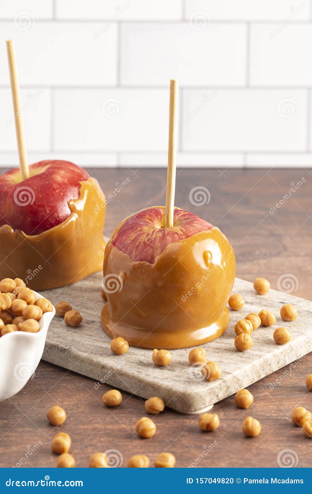 Caramel Apples on a Rustic Kitchen Cabinet Ready for Fall Stock Photo ...