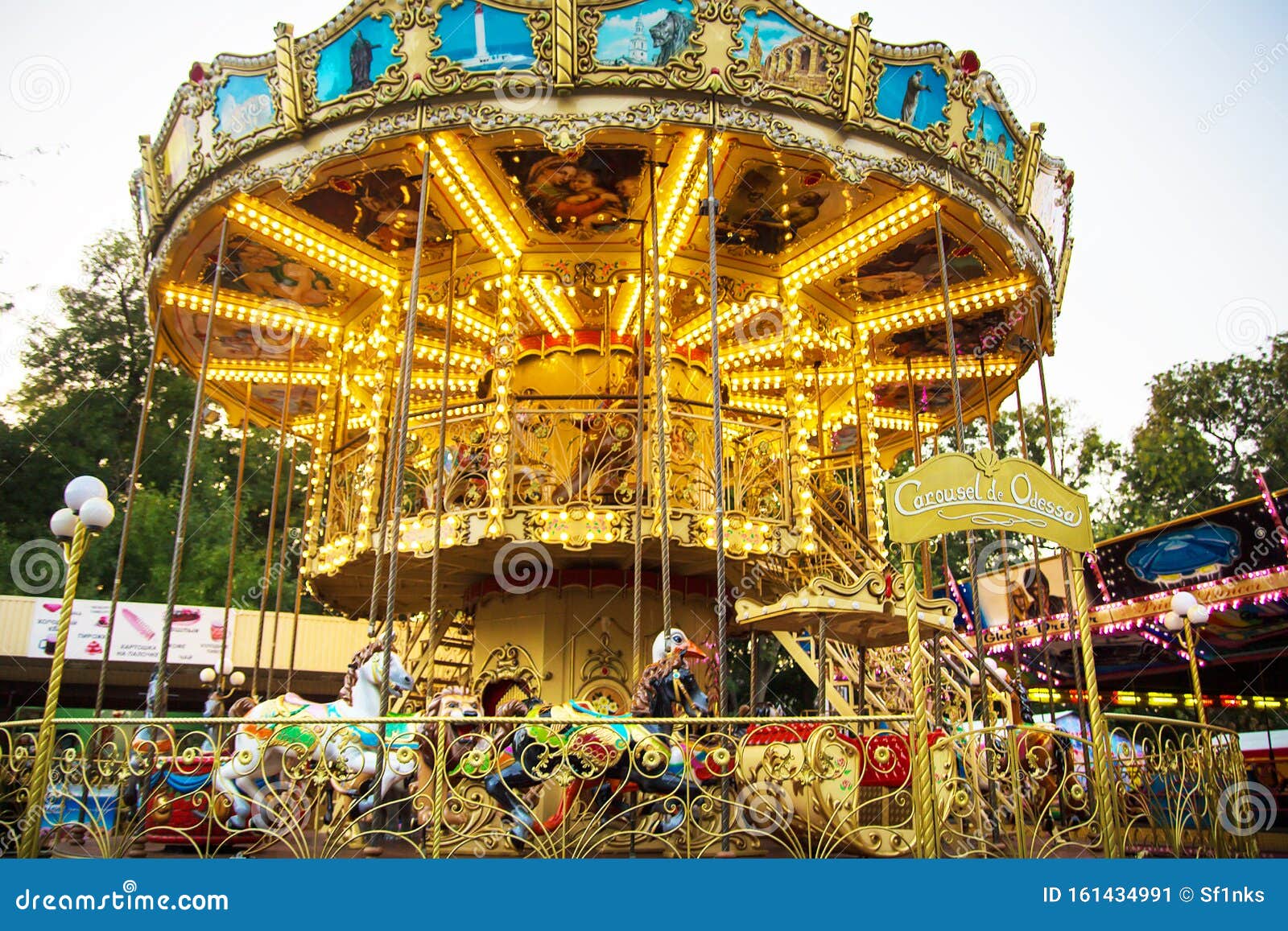 Beautiful Carousel On Background Of Large Ship. Action. Bright Carousel ...