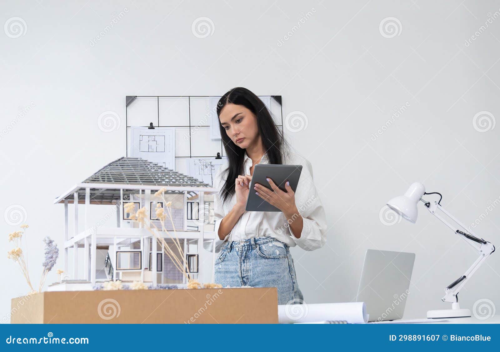 Beautiful Caucasian Architect Using Tablet To Check House Model ...