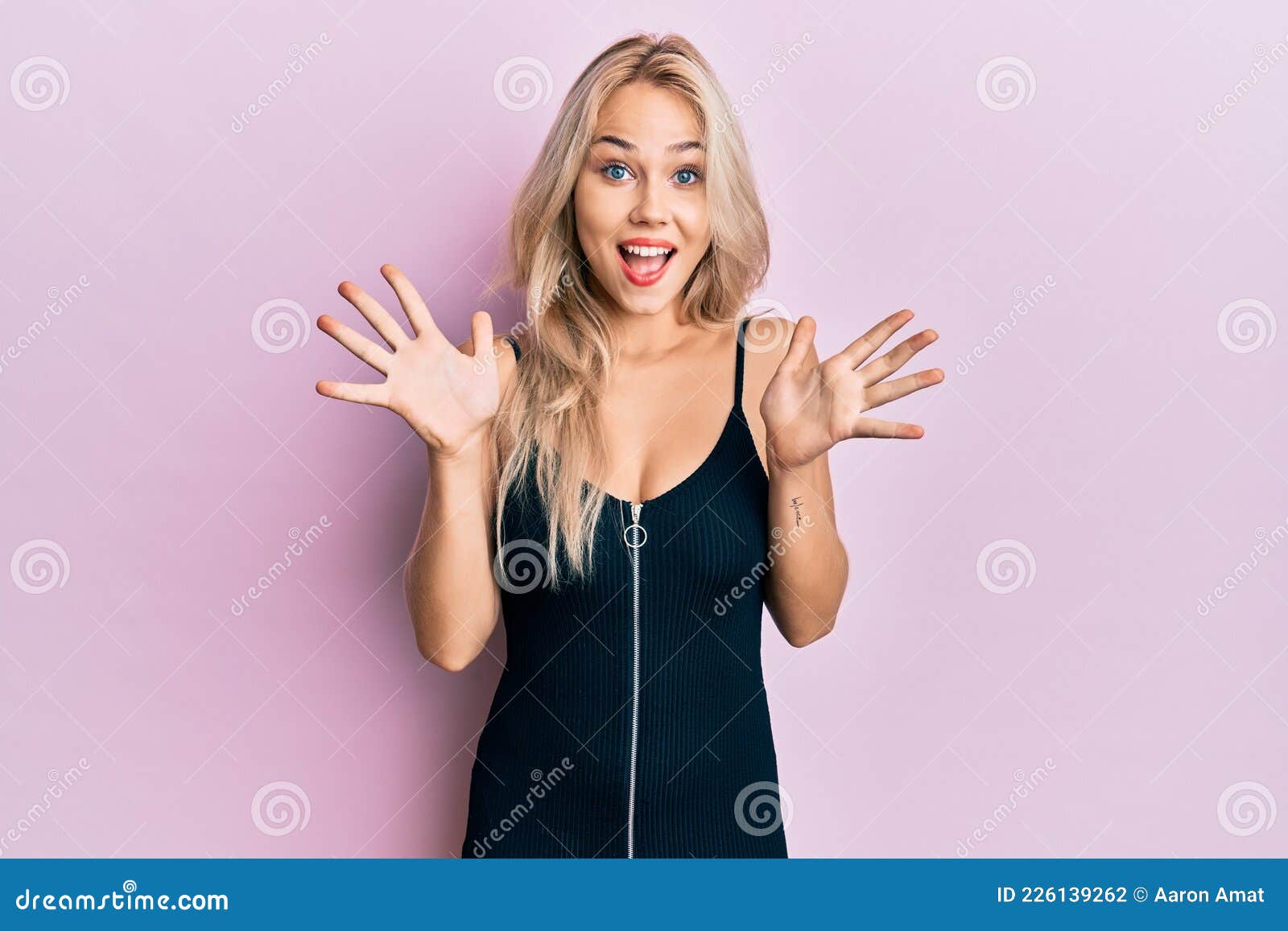 Beautiful Caucasian Blonde Girl Wearing Party Dress Celebrating Crazy