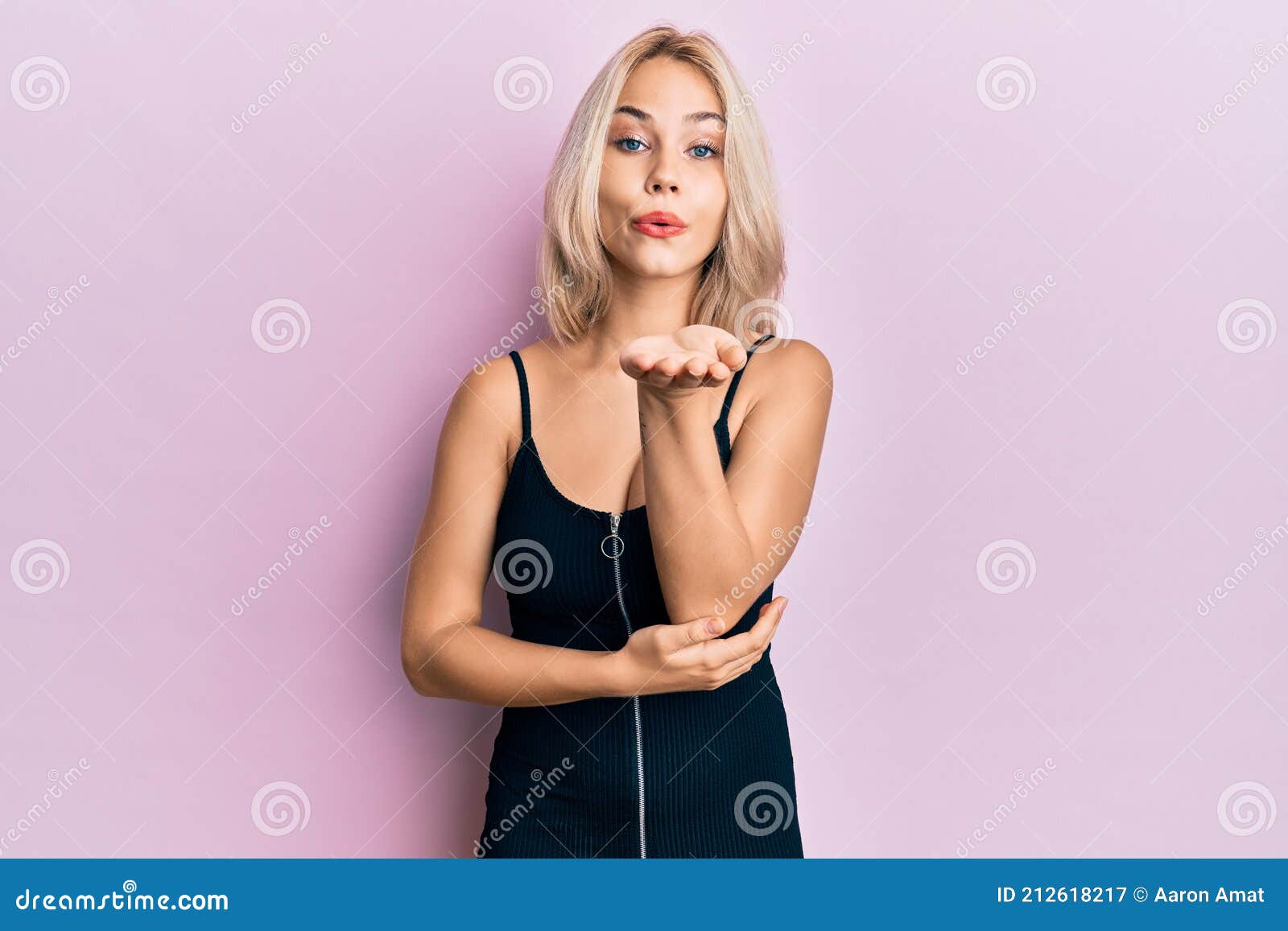 Beautiful Caucasian Blonde Girl Wearing Party Dress Looking At The