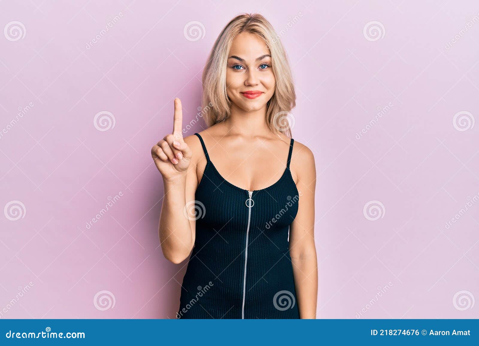 Beautiful Caucasian Blonde Girl Wearing Party Dress Showing And