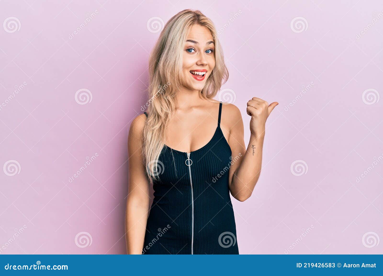 Beautiful Caucasian Blonde Girl Wearing Party Dress Smiling With Happy