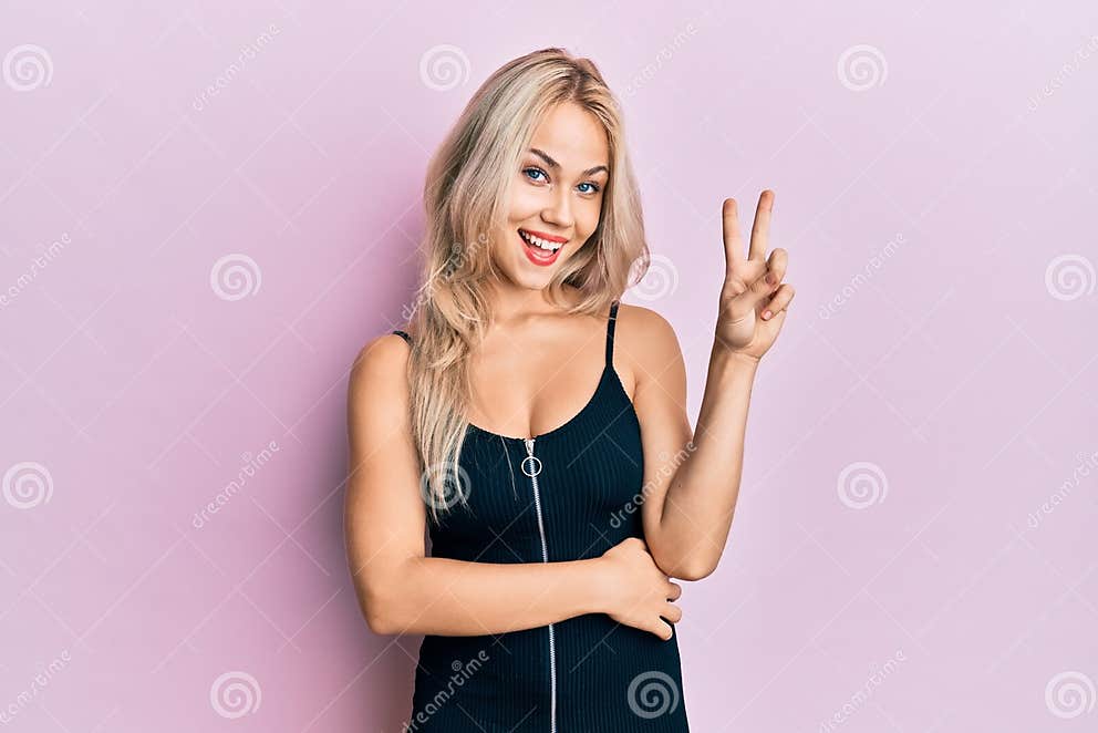 Beautiful Caucasian Blonde Girl Wearing Party Dress Smiling With Happy