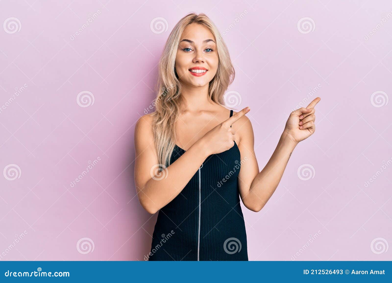 Beautiful Caucasian Blonde Girl Wearing Party Dress Smiling And Looking