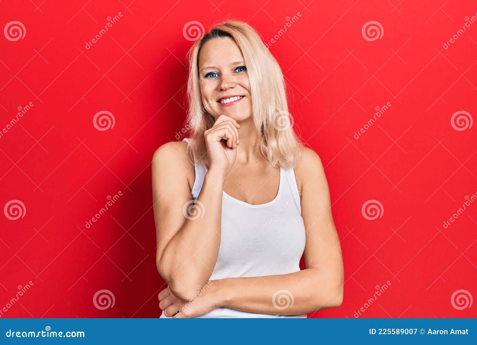 Beautiful Caucasian Blonde Woman Wearing Casual White T Shirt Looking