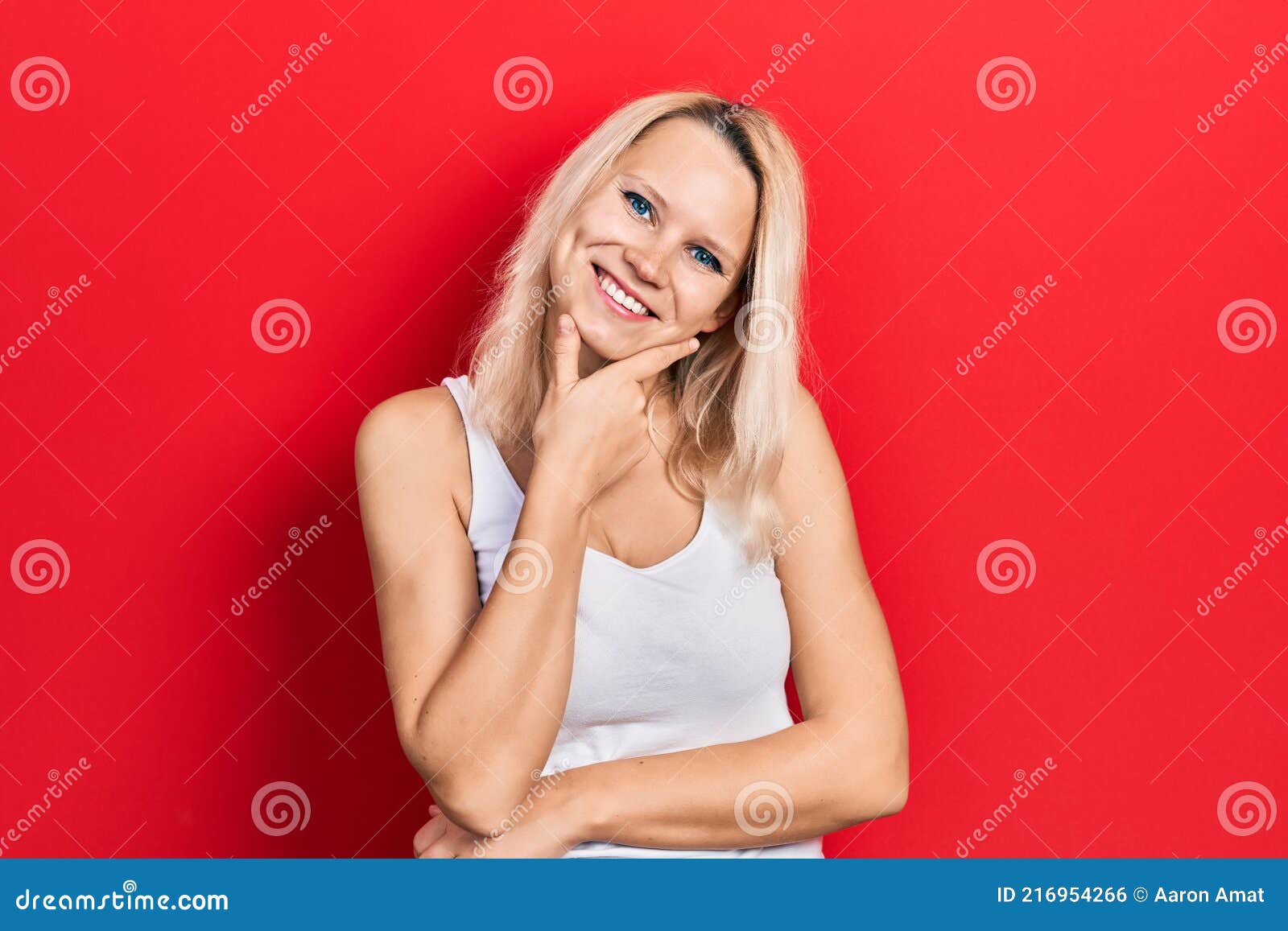Beautiful Caucasian Blonde Woman Wearing Casual White T Shirt Looking