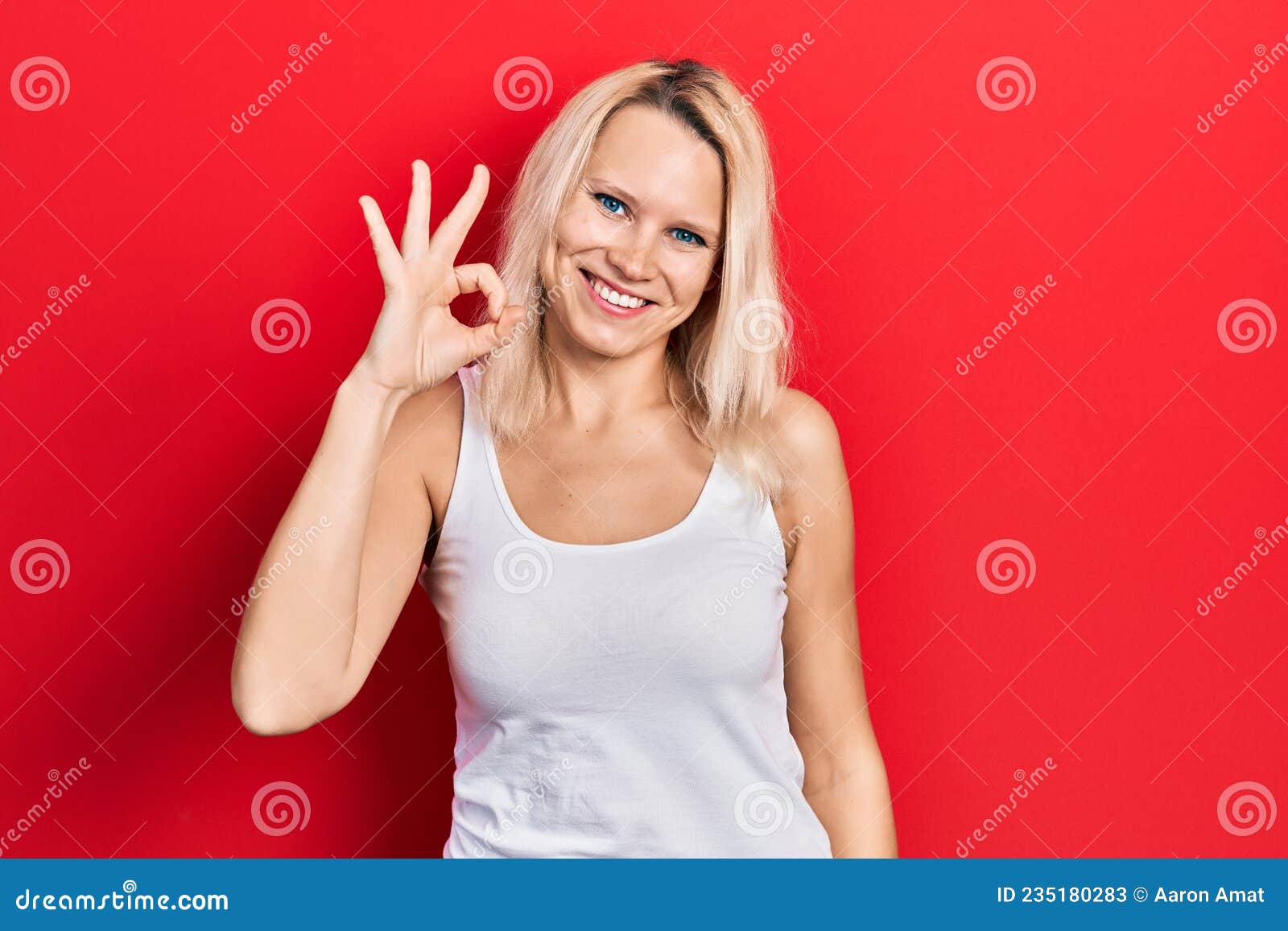 Beautiful Caucasian Blonde Woman Wearing Casual White T Shirt Smiling