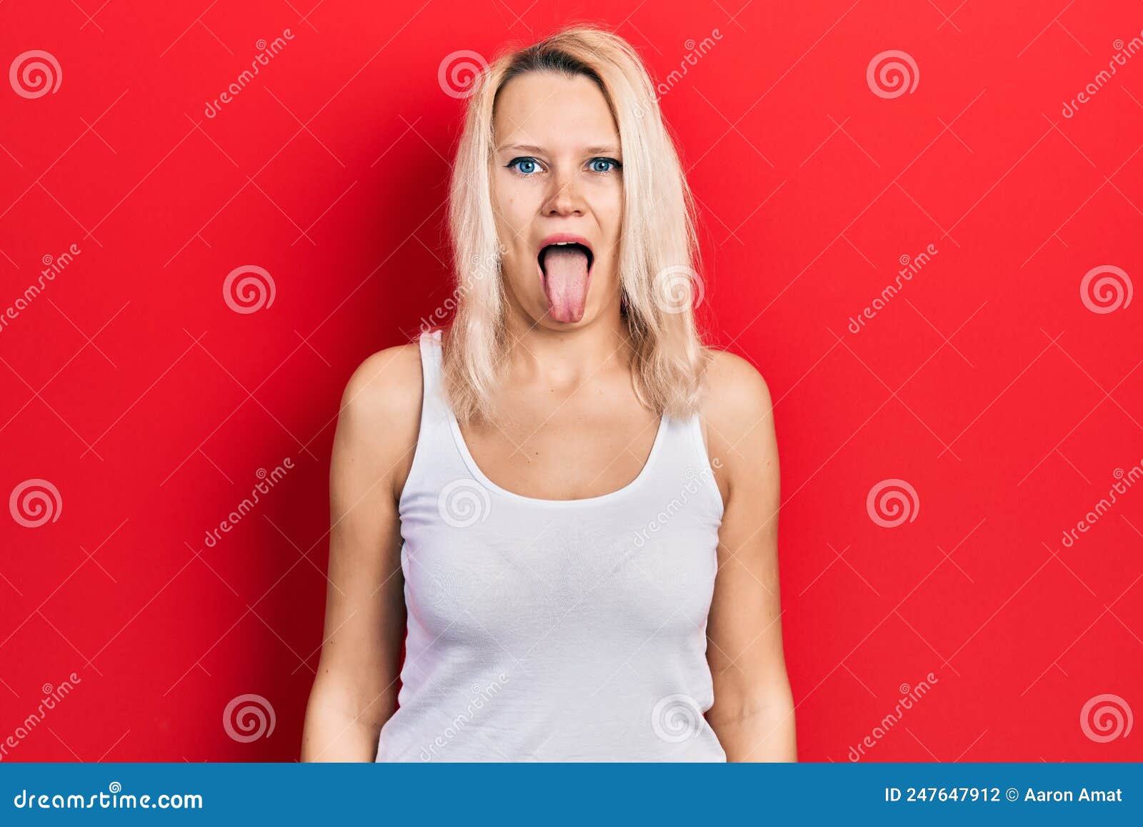 Beautiful Caucasian Blonde Woman Wearing Casual White T Shirt Sticking