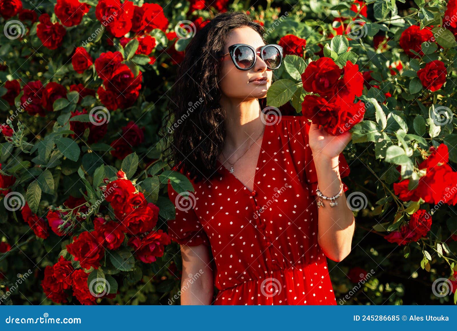 Beautiful Caucasian Girl With Curly Brunet Hair In A Trendy Vintage Red