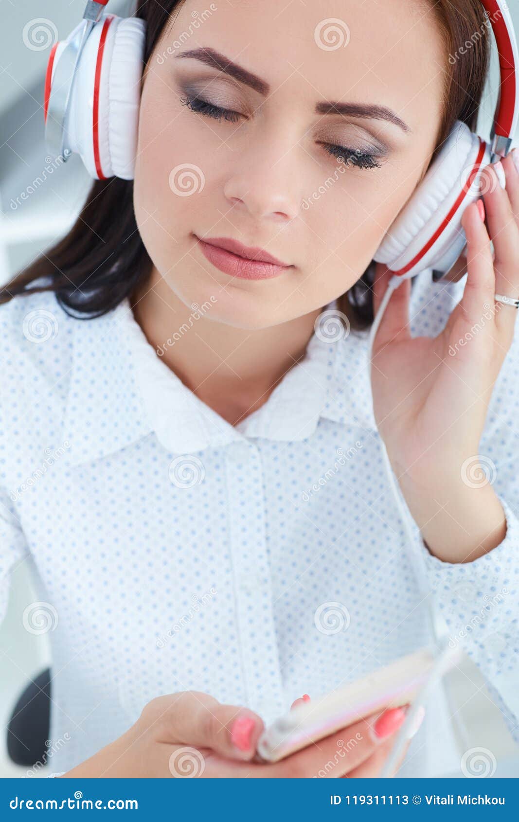 Beautiful Caucasian Girl In Headphones Listening To Music From